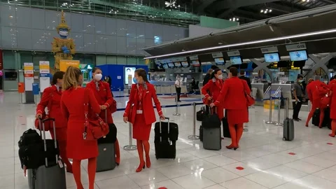 Flight attendants in red uniforms, airli... | Stock Video | Pond5