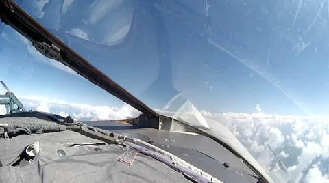 Flight over clouds view from cockpit pla... | Stock Video | Pond5