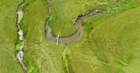 Flight top down above green field river ... | Stock Video | Pond5
