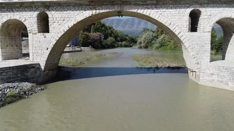Flight under the bridge of Berat, world ... | Stock Video | Pond5