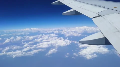 flight window view in air with bright bl... | Stock Video | Pond5