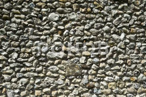 Photograph: Flint wall full frame background texture #135179567