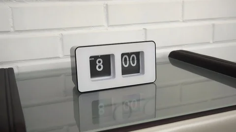 Flip clock mechanism. 8:00 AM. White bri... | Stock Video | Pond5