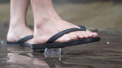 A flip flop feet walks and jumps on a cl... | Stock Video | Pond5