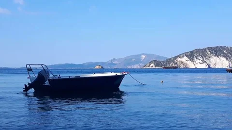 Floating boat on calm sea waters, light ... | Stock Video | Pond5