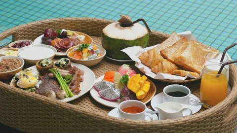 Floating breakfast in swimming pool on v... | Stock Video | Pond5