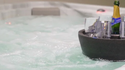 The floating champagne on the bathtub in... | Stock Video | Pond5