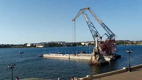 floating crane builds pontoon bridge | Stock Video | Pond5