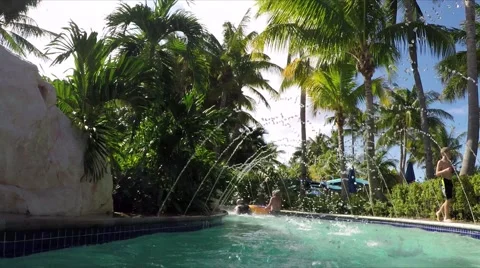 Floating down lazy river at water park t... | Stock Video | Pond5