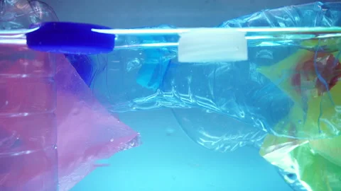Floating Plastic Waste in Water Surface,... | Stock Video | Pond5