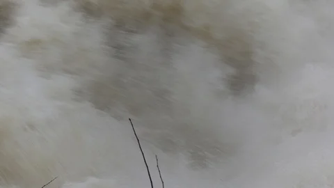 Flood waters rushing over dam during sev... | Stock Video | Pond5