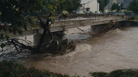 Floods high river water debris bridge da... | Stock Video | Pond5