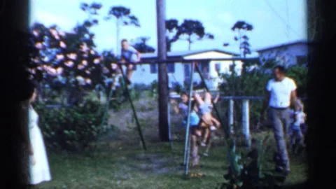 FLORIDA-1958: Kids Playing On Swing As A... | Stock Video | Pond5
