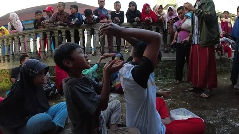 Flour relay competition on Indonesian In... | Stock Video | Pond5