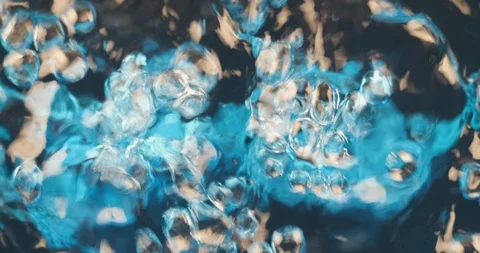 Flow of air bubbles rising from depth to... | Stock Video | Pond5
