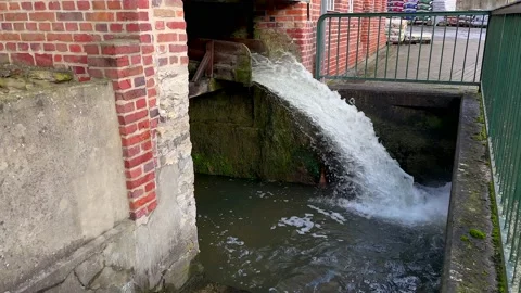 Flowing water falling down from the moun... | Stock Video | Pond5