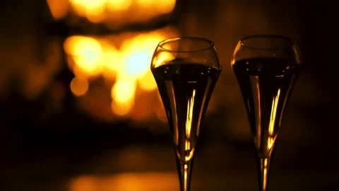 flutes of champagne, with fire in the ba... | Stock Video | Pond5