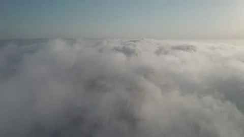 Fly through the clouds during sunrise. A... | Stock Video | Pond5