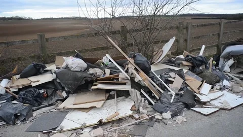 fly tipping of tyres and fridge on count... | Stock Video | Pond5