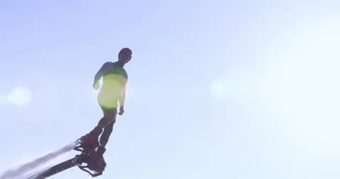 Flyboarder flying on Sky background 4K F... | Stock Video | Pond5