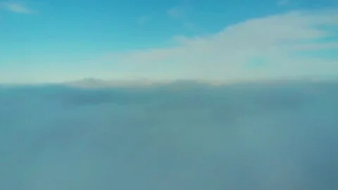 Flying above the clouds during sunset or... | Stock Video | Pond5