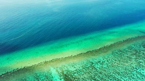 Flying above a coral reef at the edge of... | Stock Video | Pond5