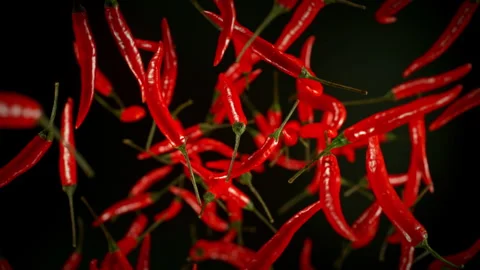 Flying and rotating red chilli peppers | Stock Video | Pond5
