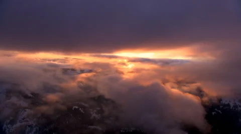 Flying between cloud layers toward risin... | Stock Video | Pond5