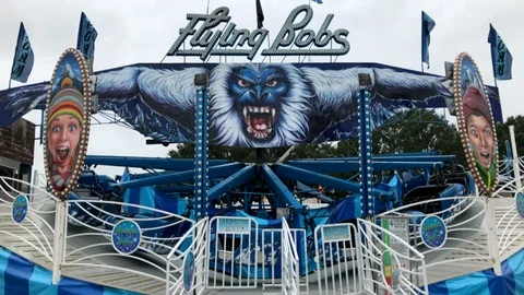 Flying bobs carnival ride spinning at th... | Stock Video | Pond5
