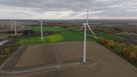 flying counter clockwise around wind tur... | Stock Video | Pond5