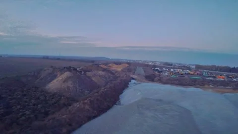 Flying low and slow over construction si... | Stock Video | Pond5