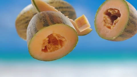 Flying Melon and Melons slices in Beach ... | Stock Video | Pond5