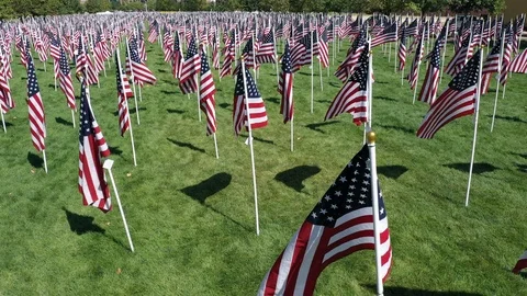 Flying over display of American Flags th... | Stock Video | Pond5