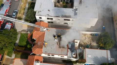Flying over firemen putting out an apart... | Stock Video | Pond5