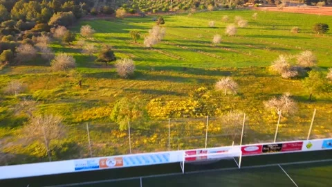 Flying from over a football field toward... | Stock Video | Pond5