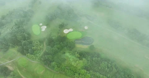 Flying over misty golf club Beautiful go... | Stock Video | Pond5