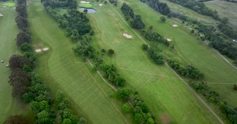 Flying over misty luxurious golf course ... | Stock Video | Pond5