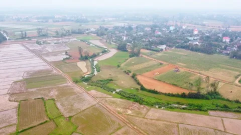 Flying Over A Small Village, Rural field... | Stock Video | Pond5