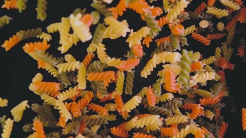 Flying pasta on black background | Stock Video | Pond5