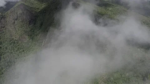 Flying through fog above hill peaks cove... | Stock Video | Pond5