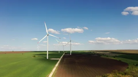 Flying through wind farm turbine blades ... | Stock Video | Pond5