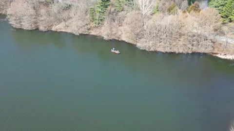 Flyover of a bass boat with two fisherma... | Stock Video | Pond5