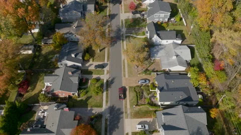 Flyover a nice suburban street in Autumn... | Stock Video | Pond5
