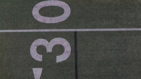 Flyover veiw of football field yardlines | Stock Video | Pond5