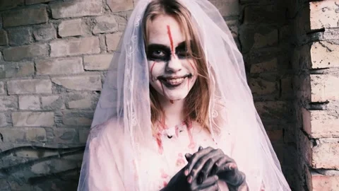Fmale zombie dead bride looks into camer... | Stock Video | Pond5