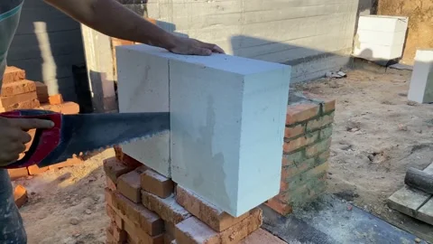 Foam block laying on a special mortar fo... | Stock Video | Pond5