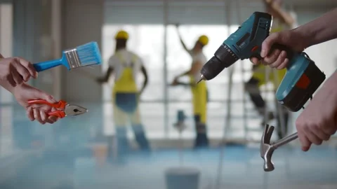 Focus on builders hands holding construc... | Stock Video | Pond5