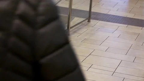 Focus on feet of people walking in front... | Stock Video | Pond5