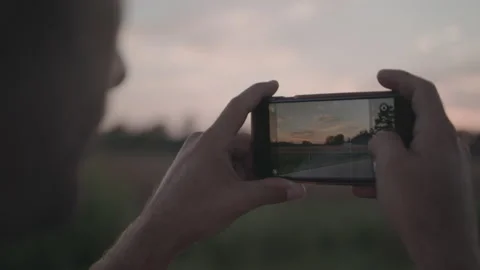 Focus on Hands on Cellphone Capturing Pi... | Stock Video | Pond5