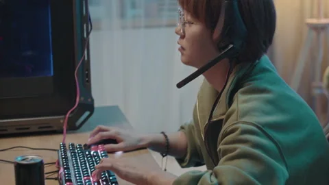 Focused Chinese Female Gamer Playing on ... | Stock Video | Pond5
